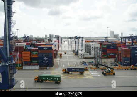 Container terminal with trucks and boxes from different shippers lined ...