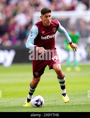 West Ham United's Edson Alvarez walks off the field after being shown a ...