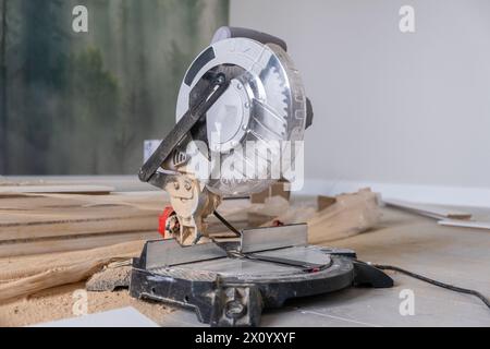 The miter saw or a multi material construction saw on the floor of the ...
