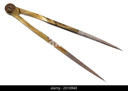 Old metal divider on a map on the captain's table aboard a pirate ship ...