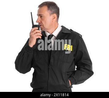 Mature FBI agent with two-way radio on black background Stock Photo - Alamy
