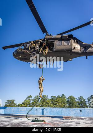 2024 Best Ranger Competition competitors fast rope from a UH-60 ...