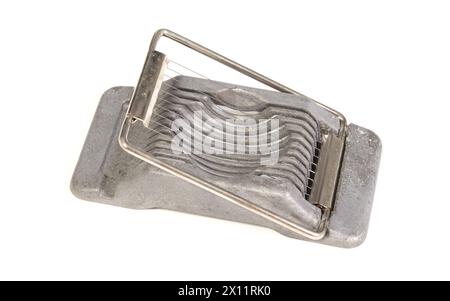 Very old egg cutter isolated on a solid background Stock Photo - Alamy