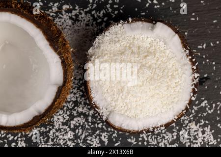 white coconut pulp and dried coconut flakes, a close-up of which is ...