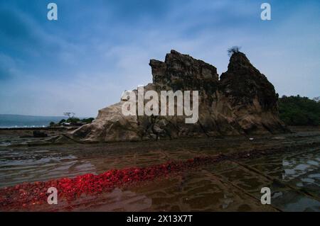 The Batu Layar stone monument at Sawarna beach, Banten, Indonesia Stock ...