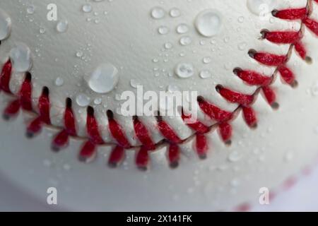 white baseball ball tied with red thread, a real round baseball ball ...