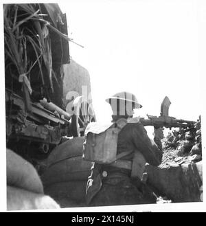 A Bren gunner fires from a captured pillbox during the Battle of the ...