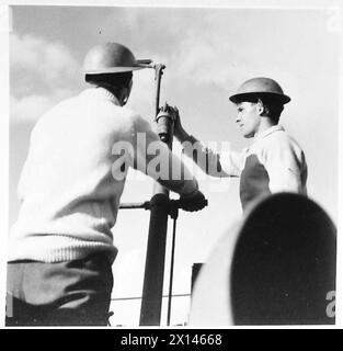 ANTI-SUBMARINE PATROL GOES A-HUNTING - Under way; leaving the harbour ...