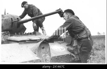 ARMOURED DIVISION TRAIN FOR BATTLE - "Covenanter" tanks emerging from ...