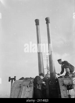 In 1942, during Home Fleet operations, crew aboard HMS Eskimo cleaned ...