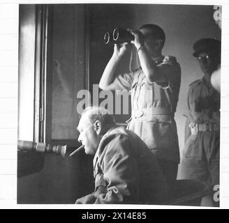 The Prime Minister observes artillery fire from a forward Observation ...