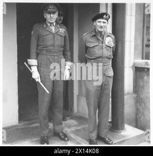 Lieutenant-General Brian Horrocks of 30 Corps studies maps with ...