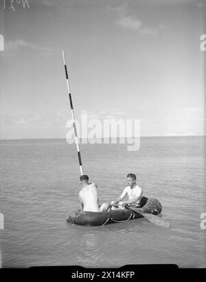 Two Naval Commandos of the Royal Navy charge forward with guns raised ...