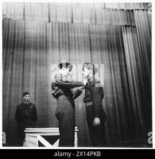 INVESTITURE 12 Corps Troops - Gnr. H.G. Cubbon, 7 Svy Regt RA receives ...
