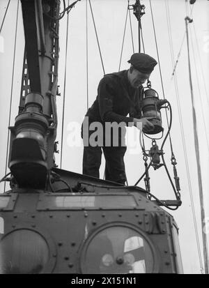 WITH THE ROYAL NETHERLANDS NAVY. 1940, OR 1941. ON BOARD A DUTCH ...