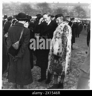 Mrs. Churchill and Mr. Harry Hopkins observe a flying demonstration ...