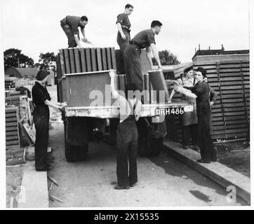 SOLDIERS HELP IN INDUSTRY - The soldiers helping to load the huts on to ...