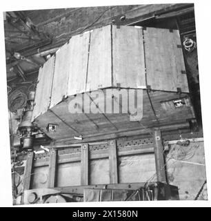 American Sherman tanks are packed and sealed in wooden crates on the ...