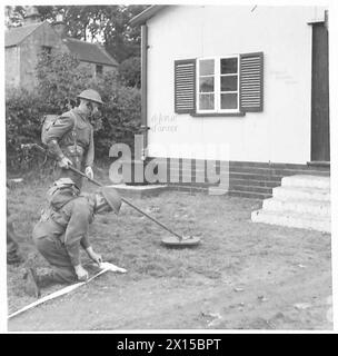 Sappers demonstrate mine clearance by using a prodding technique to ...