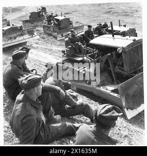 ARMY MOTOR TRACTOR SCHOOL - Bulldozers at work on the training ground ...