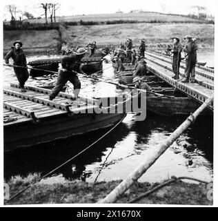 Royal Engineers construct a bridge using pile drivers, demonstrating ...