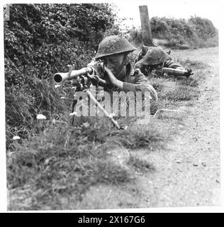 BATTLE SCHOOL EXERCISE - Bren gunner in action, gives cover fire during ...