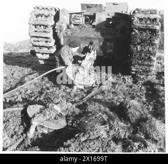 RECOVERING A CHURCHILL TANK - A 50-ton snatch block is loaded on to ...