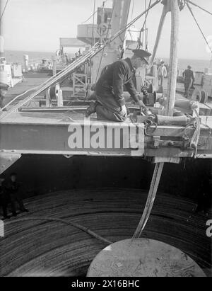 LAYING THE 17TH "PLUTO". 24 MAY 1945, ON BOARD THE CABLE LAYING SHIP ...