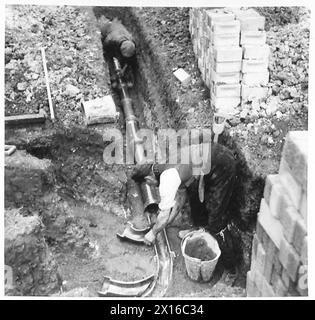 ANOTHER NEW ARMY CAMP - At work on drainage for sanitary and ablution ...