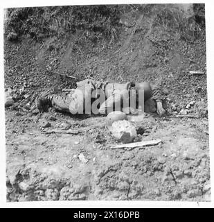 A German soldier lies dead outside a dug-out during World War I. The ...