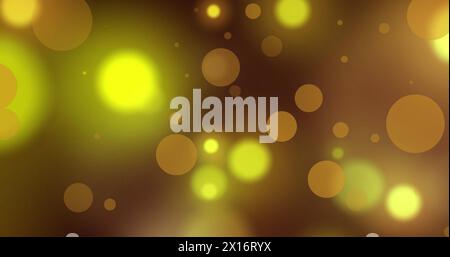 Image of glowing yellow and orange spots of light against black ...