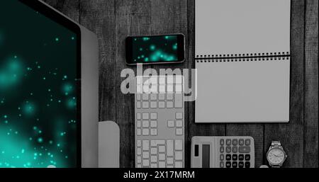 Image of technological devices with light spots on screen on desk Stock ...