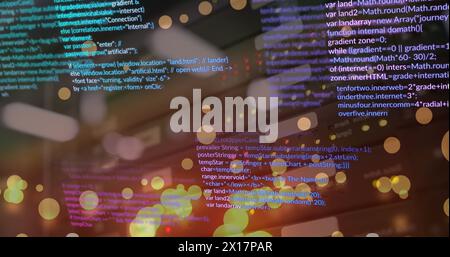 Image of computer language and falling lens flares over multiple modems ...