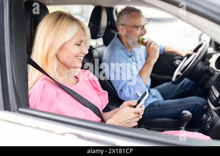 Smiling woman driving her car, traveling on a sunny day Stock Photo - Alamy