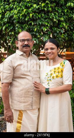 A Picture of middle aged malayali man and woman wearing a traditional ...