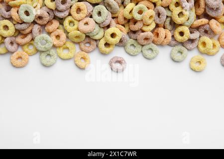 Tasty cereal rings on white background Stock Photo - Alamy