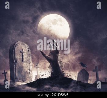 Hand rising out from the grave Stock Photo - Alamy