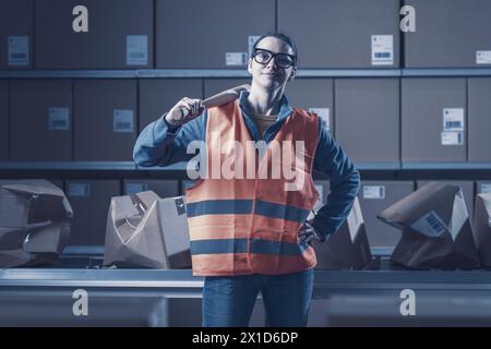 Confident Smiling Rebellious Worker Posing With A Baseball Bat At The