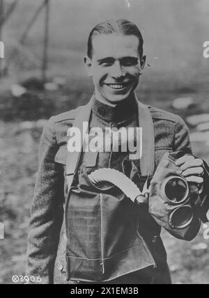 World War I photos: Grinning soldier holding his gas mask ca. 1918 ...