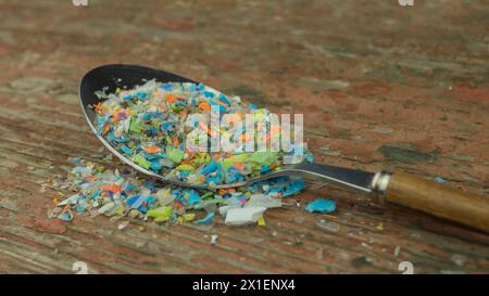 Microplastics in a spoon. A concept of consuming micro plastic ...