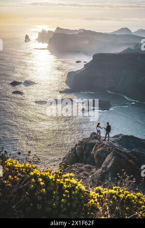 Description: Young tourist couple kissing at beautiful viewpoint on ...