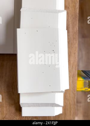 Installing Vinyl Baseboards in a Modern Home Renovation Project Stock ...