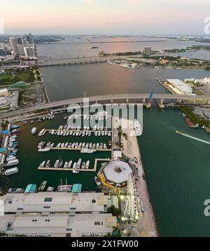Luxury yacht docked at a Miami marina with raised drawbridge and ...
