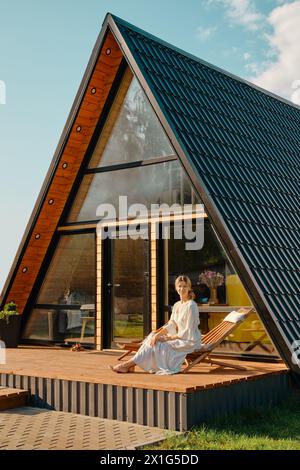 Woman rests on terrace in mountains Stock Photo - Alamy