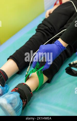 Child undergoing electrocardiogram test in pediatric clinic Stock Photo ...