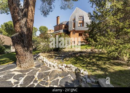Estate with slate tile paths and chalet with characteristic roof of the ...