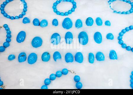 A selection of polished Persian turquoise gemstones displayed in a ...