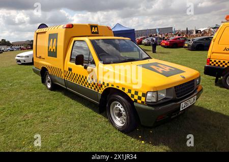 Three-quarters front view of an AA Patrol Services, Yellow, 1963 ...