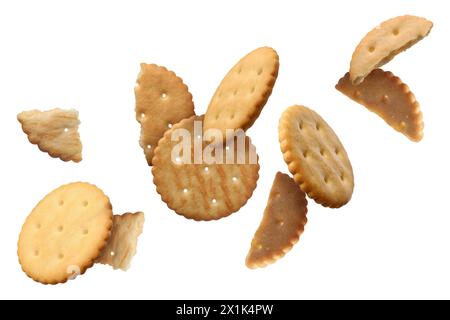 Tasty dry crackers falling on white background Stock Photo - Alamy