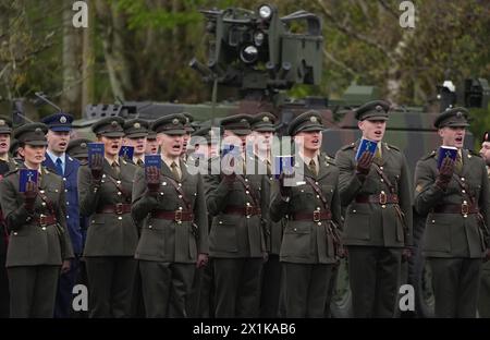 Cadets holding the Bible during the commissioning ceremony of the 99th ...
